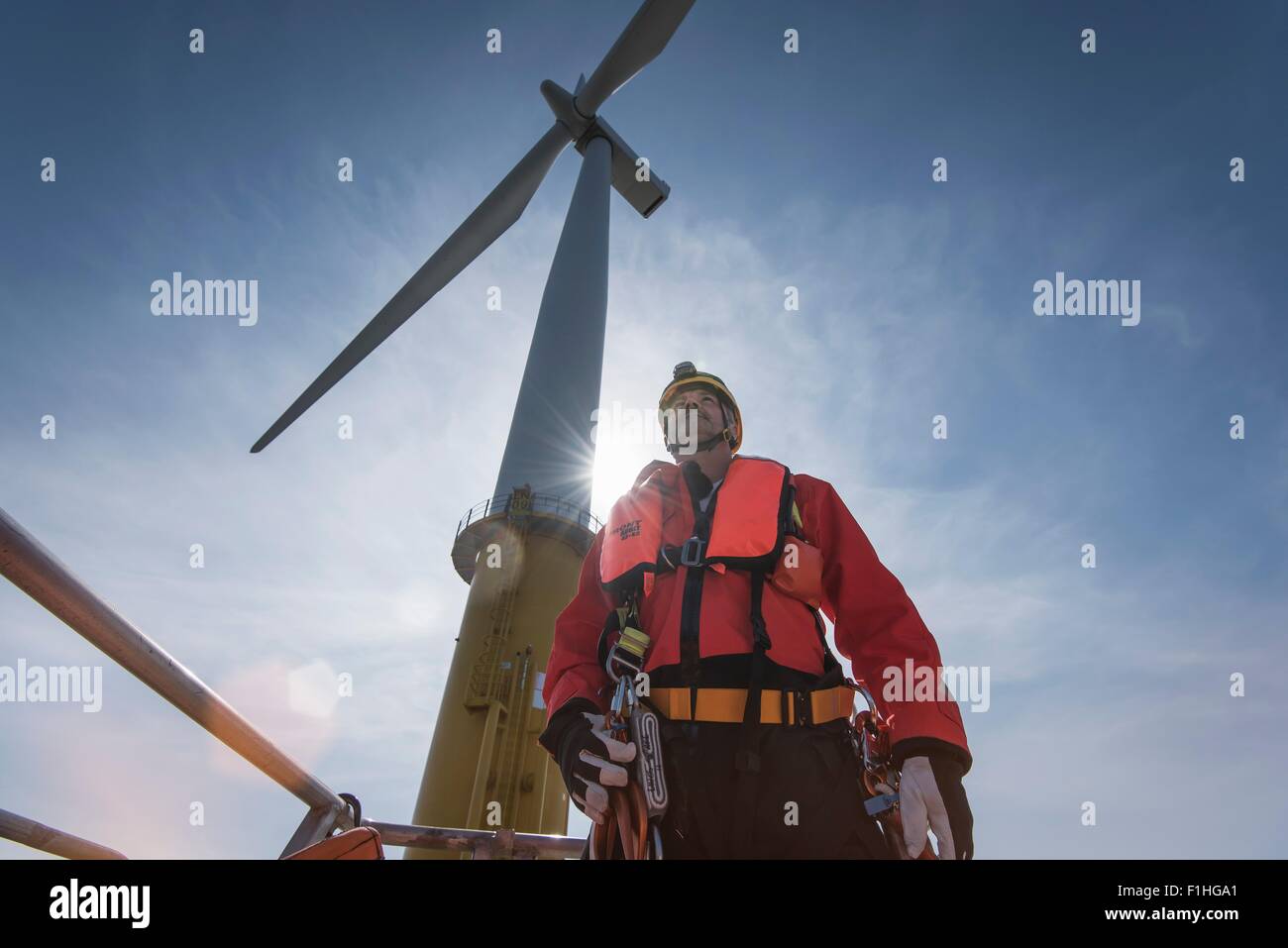 Man climbing wind turbine man wind farm hi-res stock photography and ...