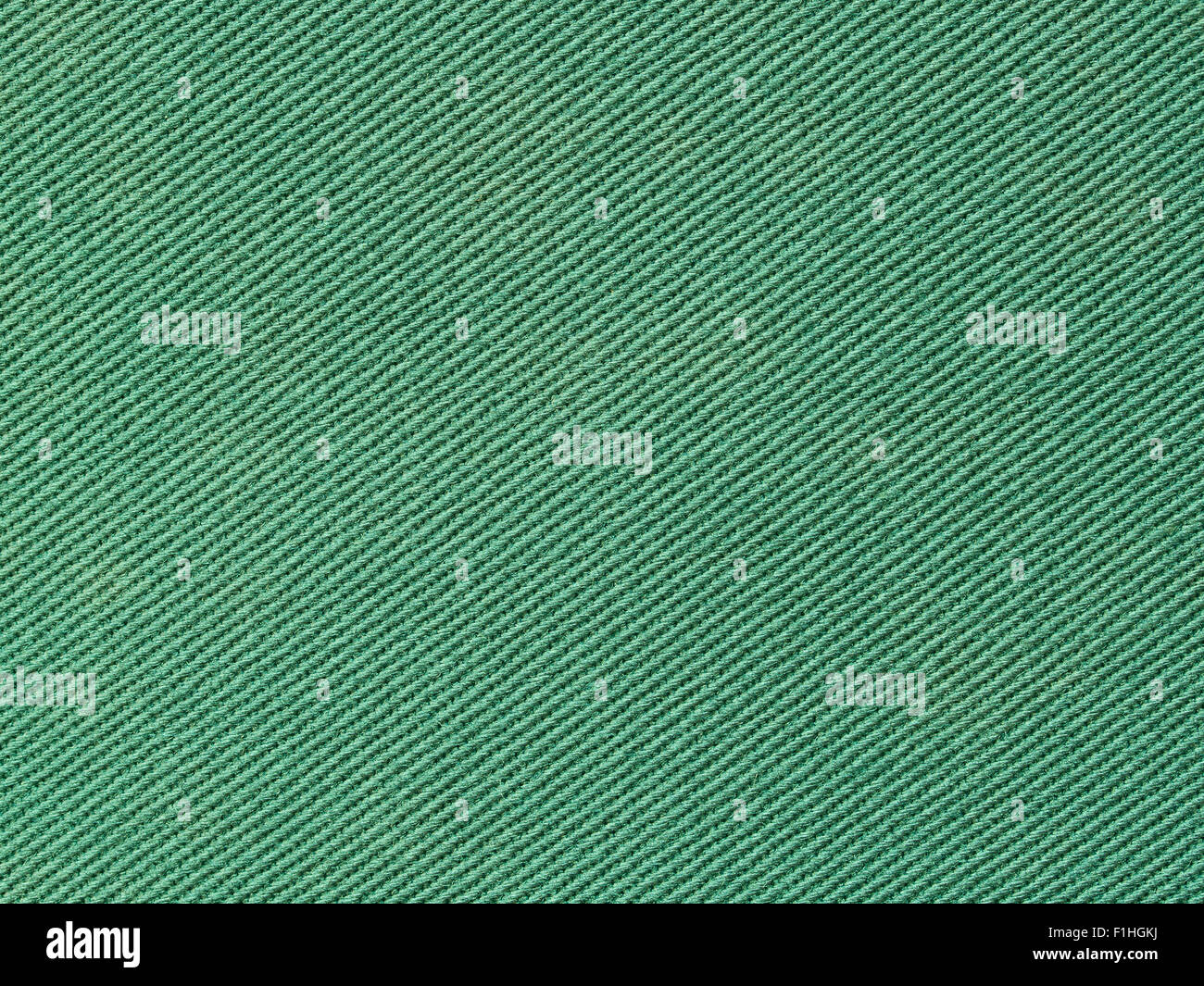 Closeup detail of green fabric texture background Stock Photo - Alamy