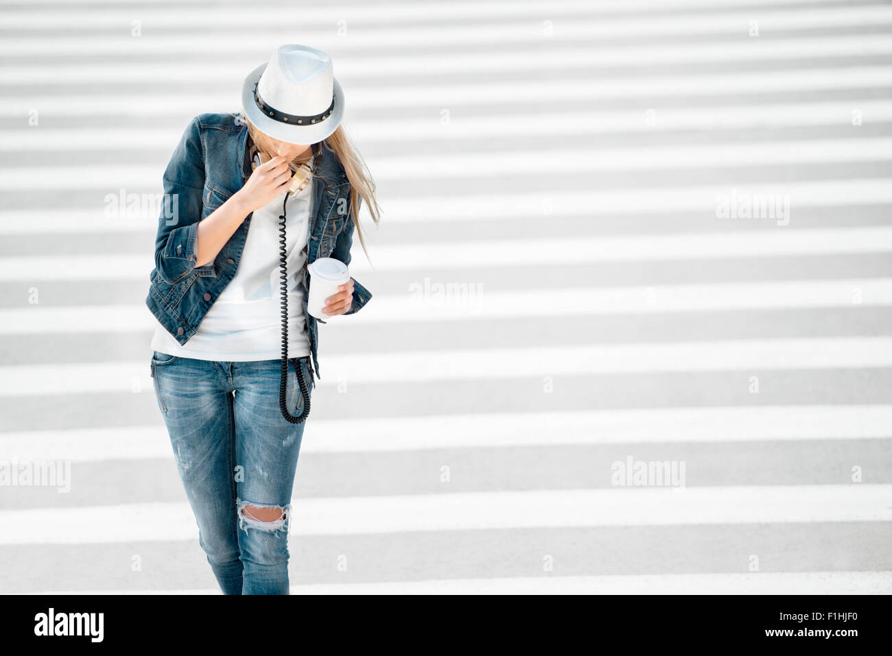 Walking on zebra cross Stock Photo - Alamy