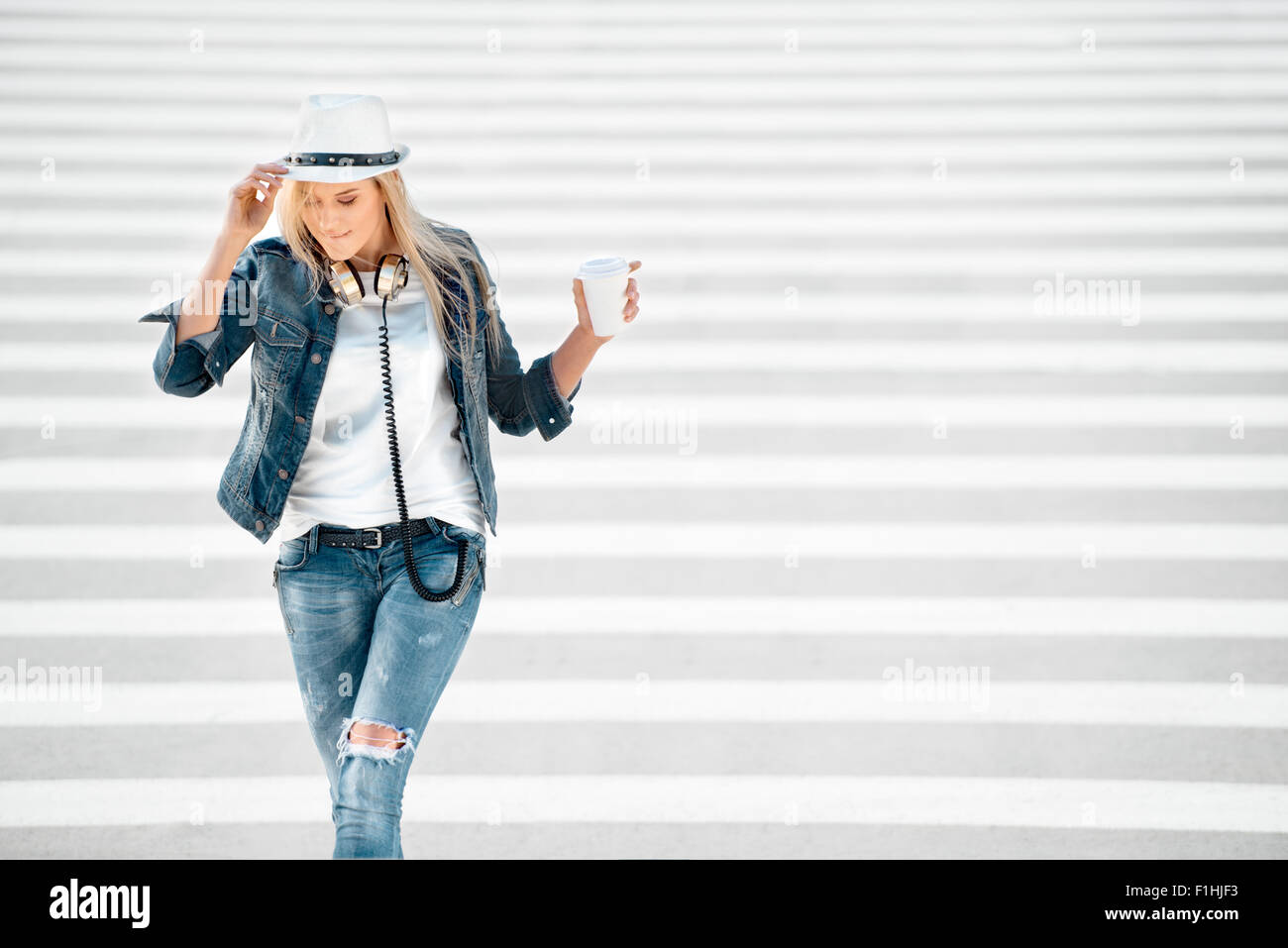 Walking on zebra cross Stock Photo - Alamy