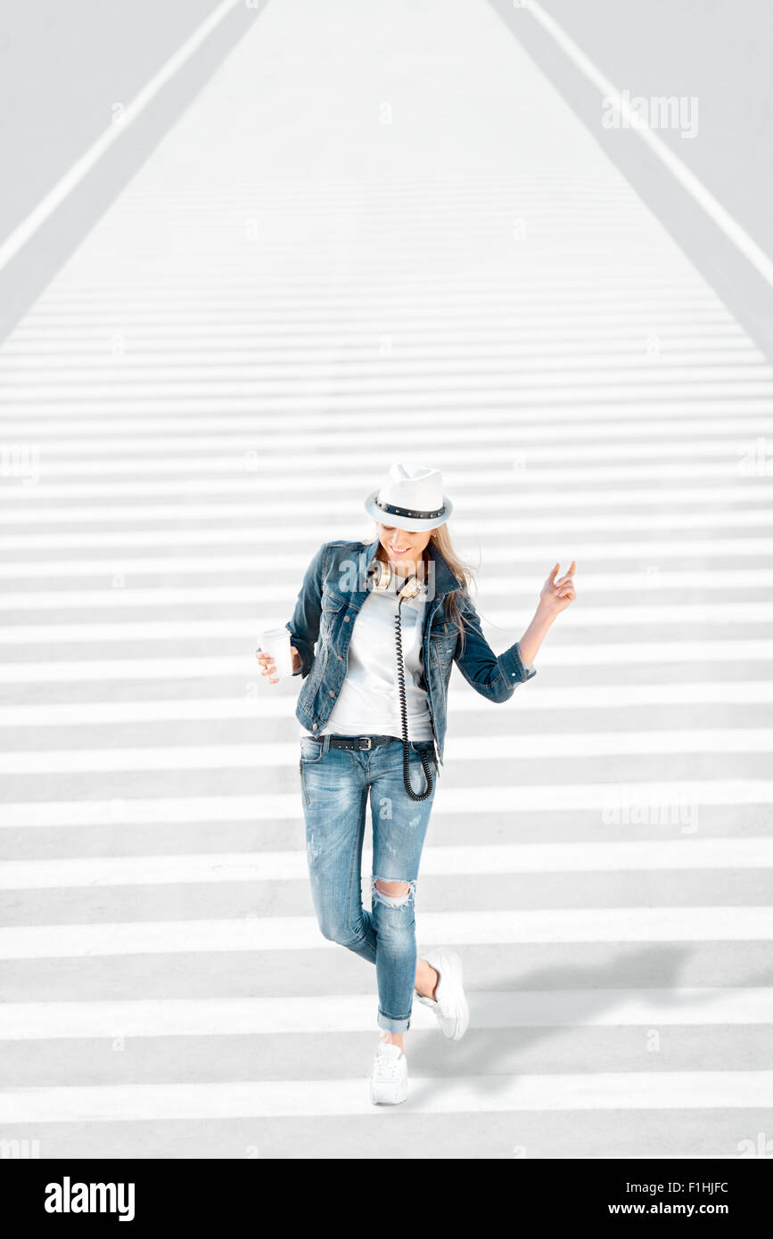 Walking on zebra cross Stock Photo - Alamy