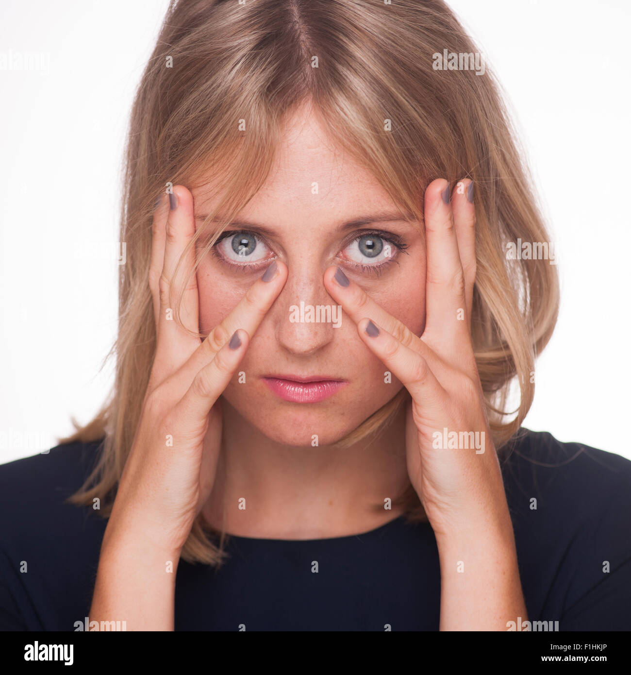 Blonde woman covering face hands hi-res stock photography and images ...