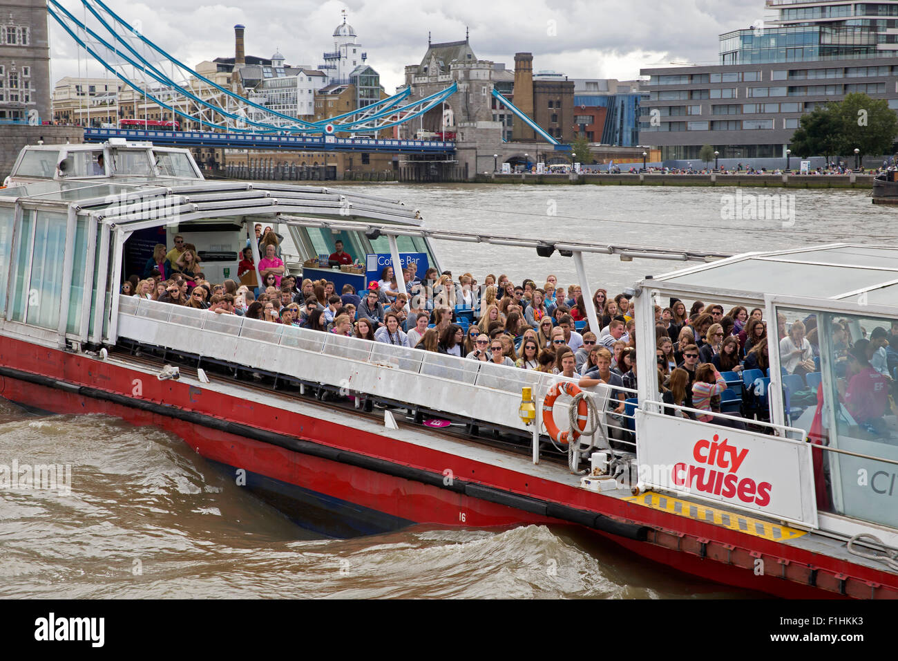 City cruises boat on the River thames by Tower Bridge in London Stock ...