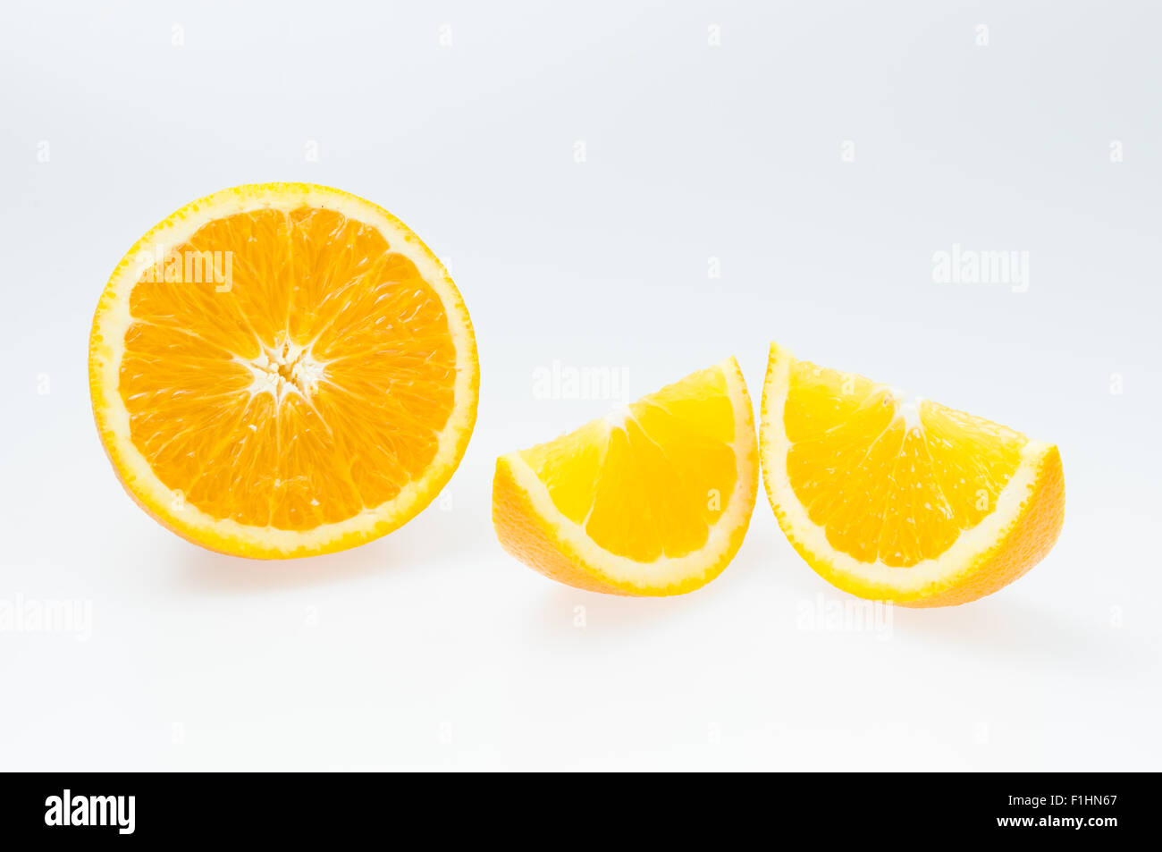 Slice of ripe orange isolated on white Stock Photo - Alamy