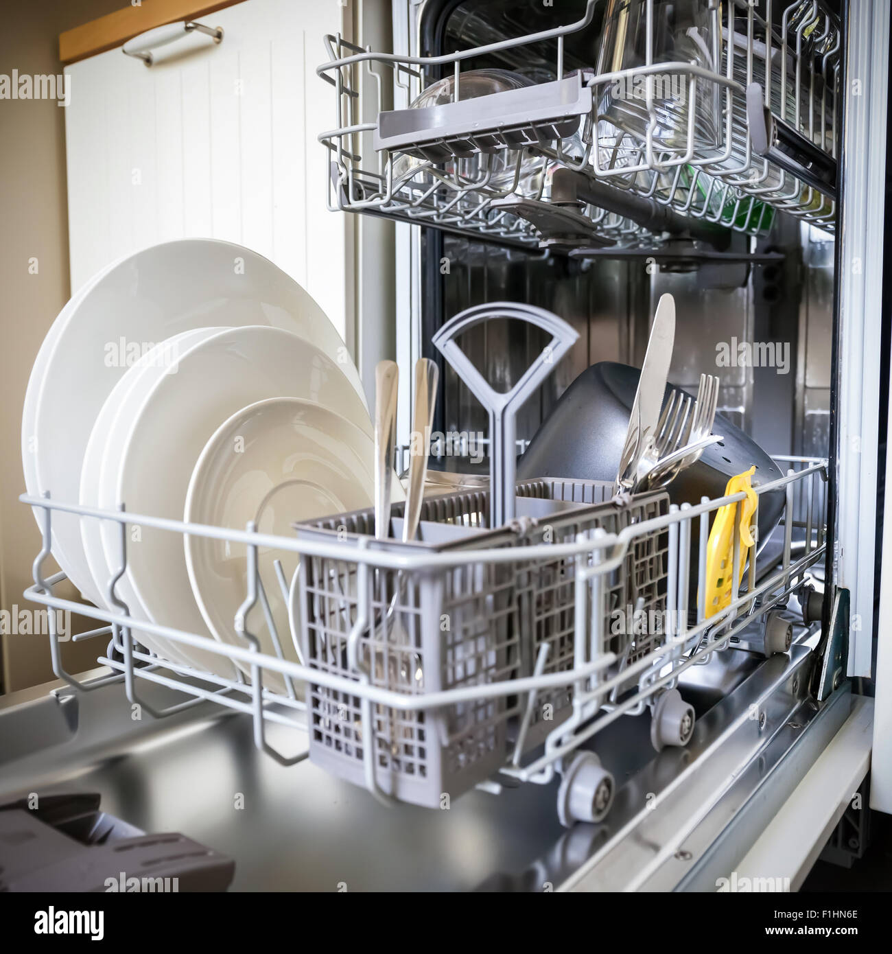 Open dishwasher with clean glass and dishes, selective focus Stock ...