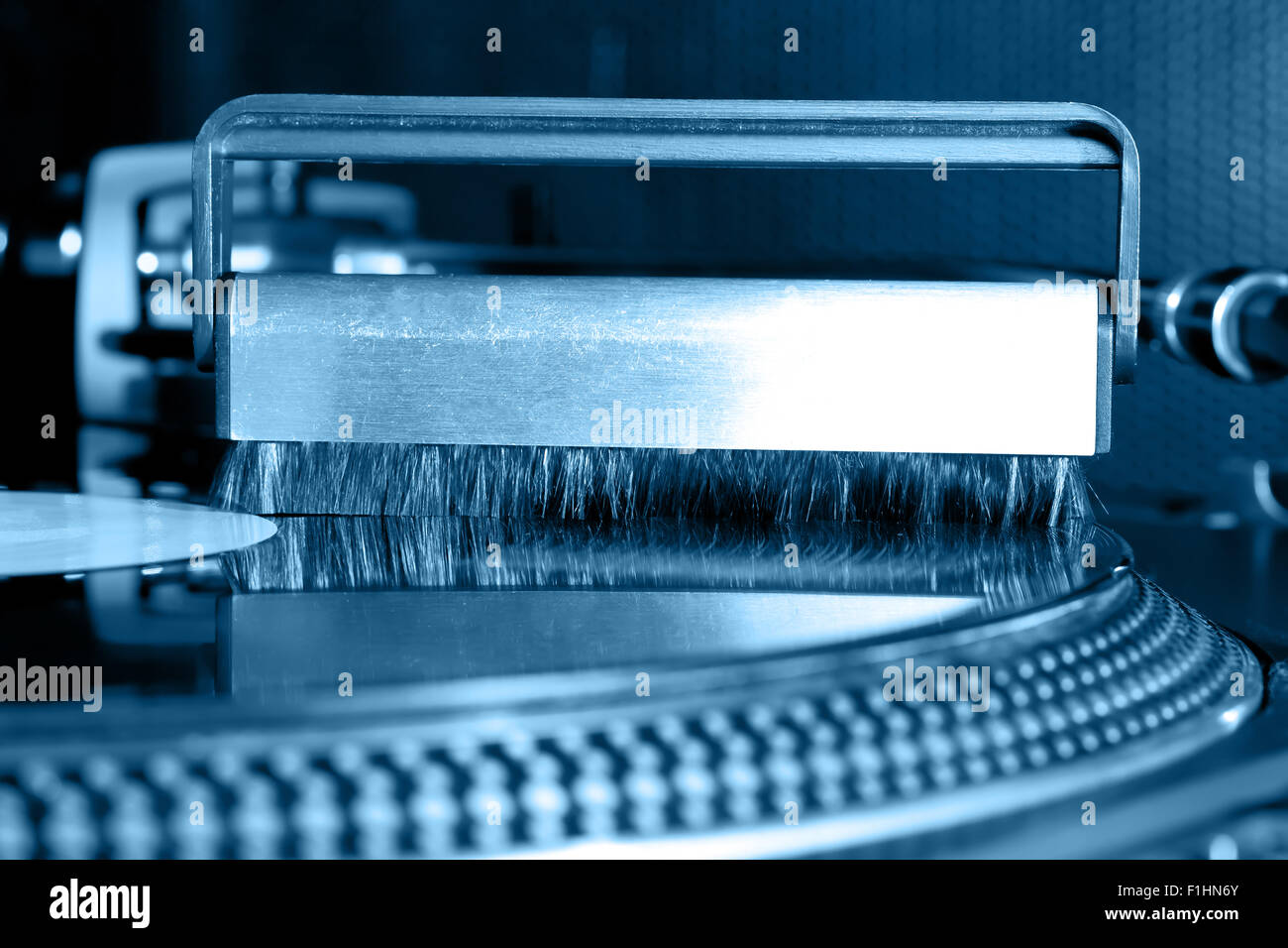 Cleaning vinyl record. Brush on turntable Stock Photo - Alamy