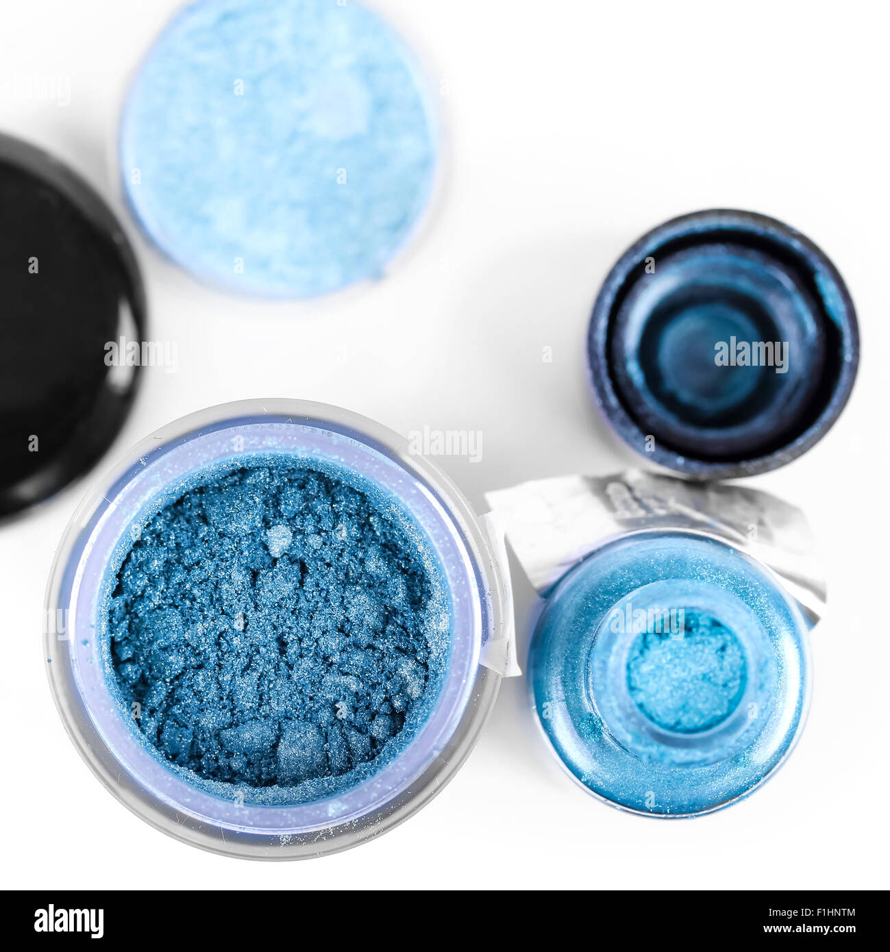Blue make-up pigment eyeshadows on white background Stock Photo - Alamy