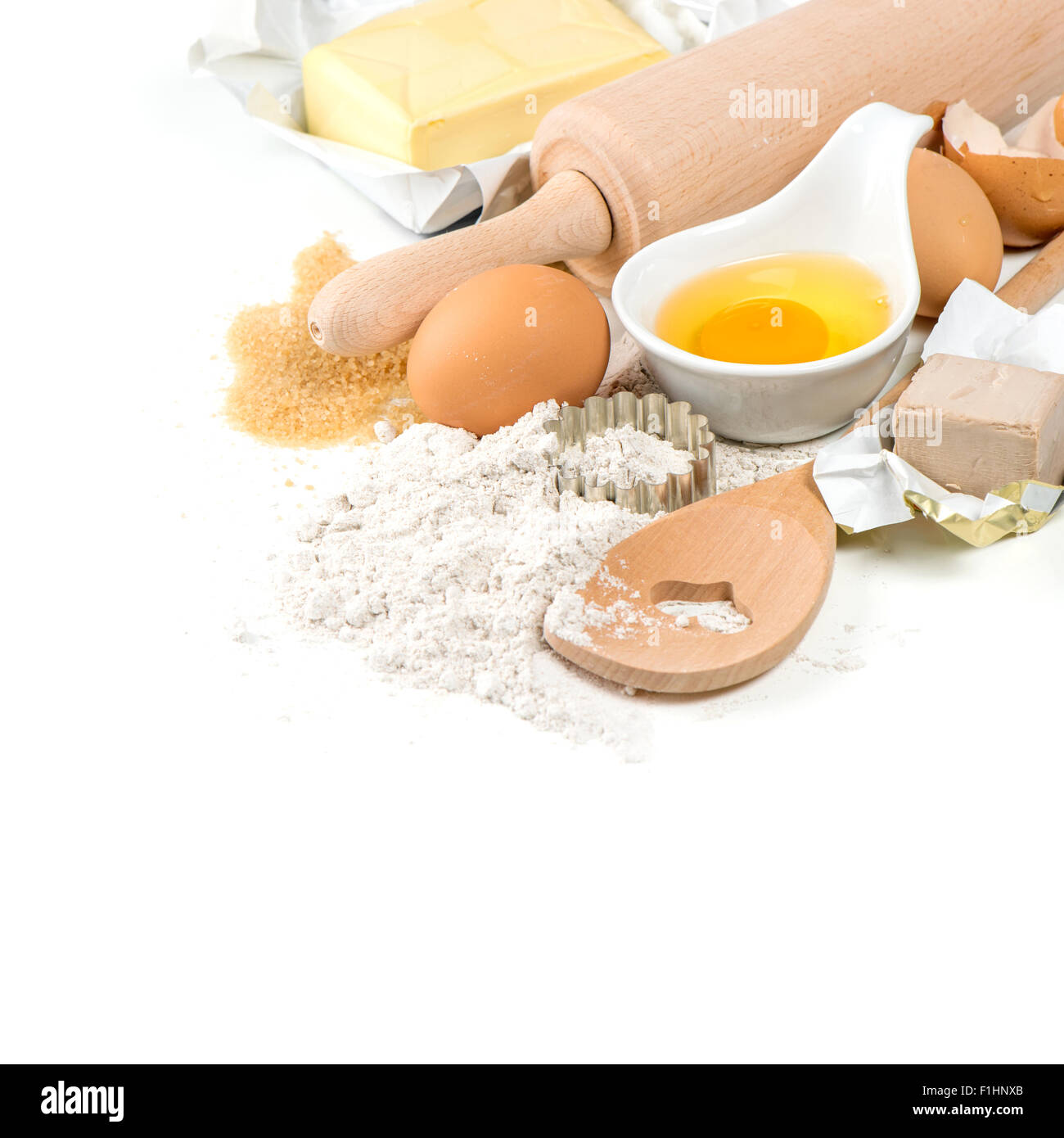 baking ingredients eggs, flour, yeast, sugar, butter. kitchen utensils ...