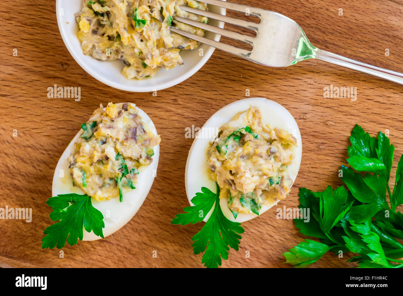 Tapas stuffed eggs with parsley top view Stock Photo - Alamy
