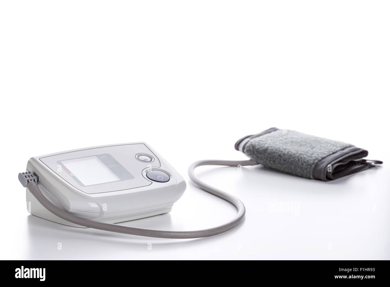 Digital Blood Pressure Monitor closeup on white background Stock Photo ...