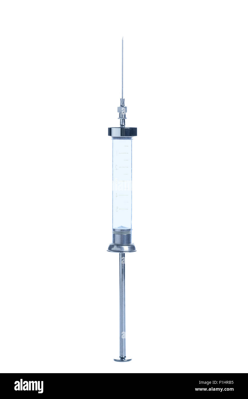Old glass multiple use syringe with needle, closeup on white background ...