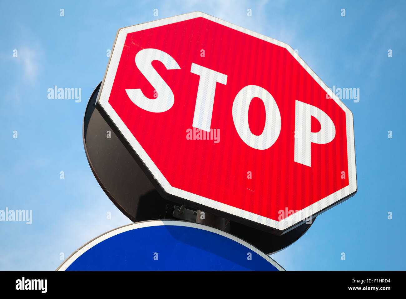 Classical red Stop road sign over blue sky background Stock Photo - Alamy