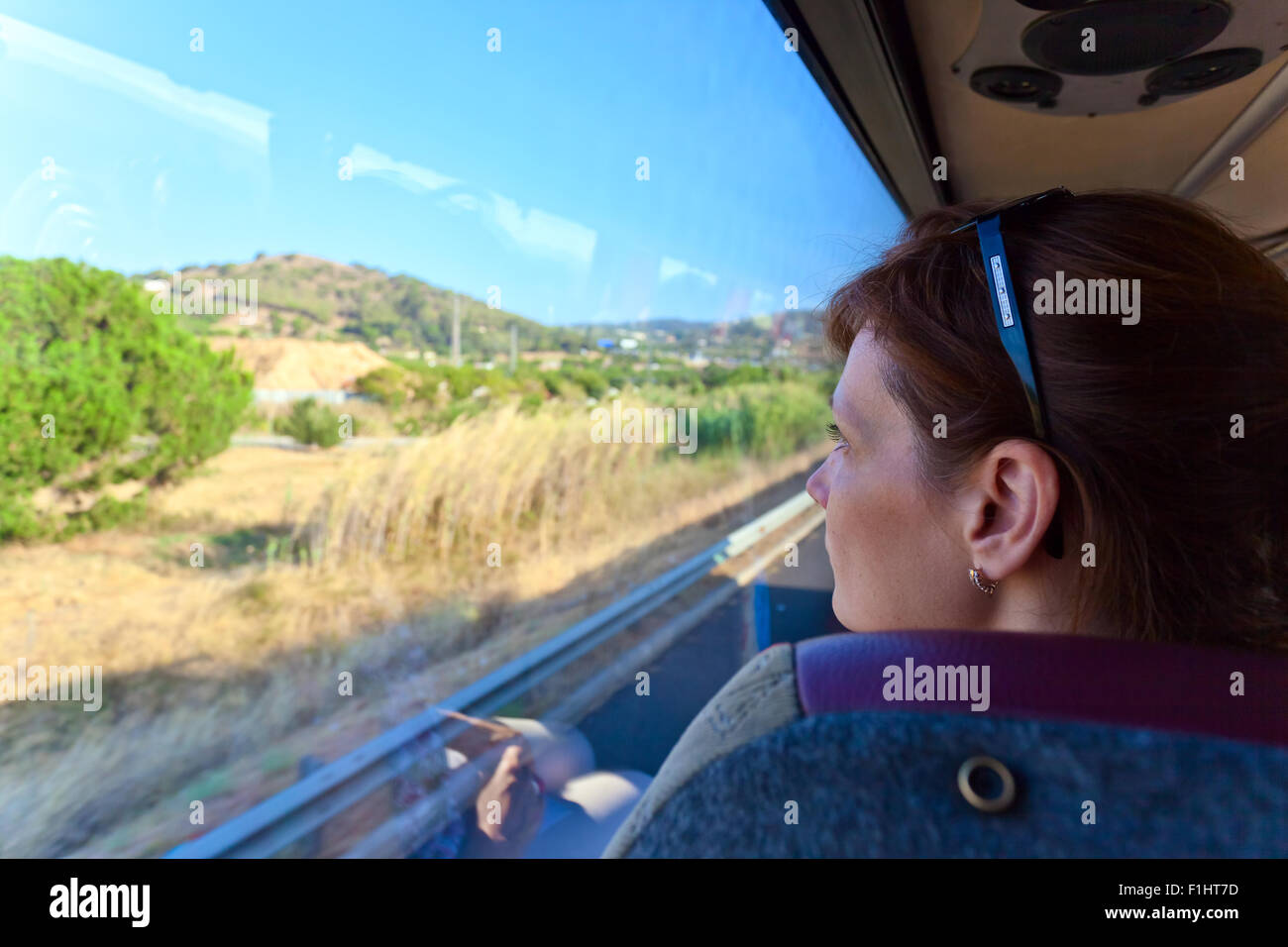 Person looking out of bus window hi-res stock photography and images ...