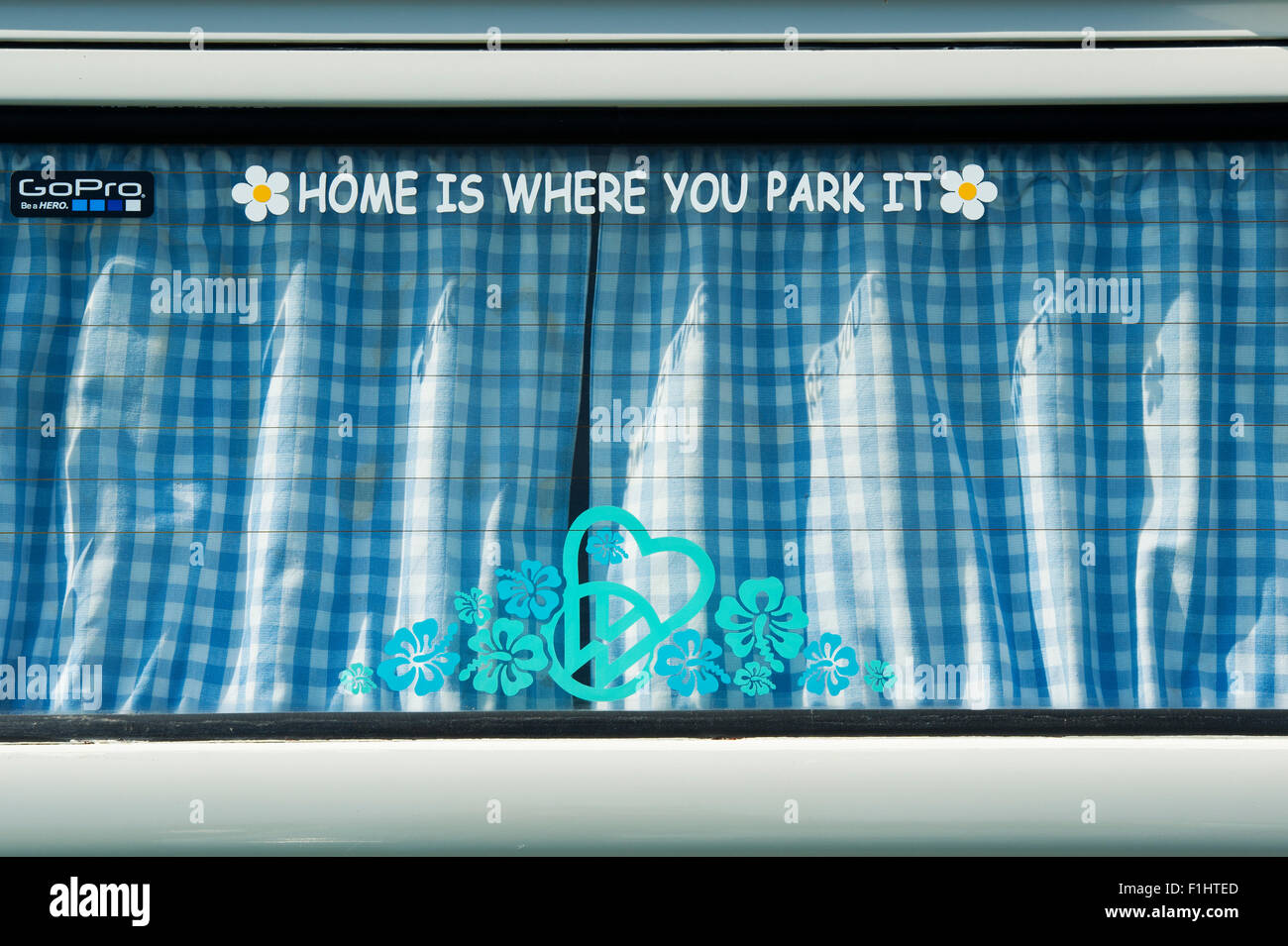 VW Volkswagen camper van rear end window with sticker 'Home is where ...