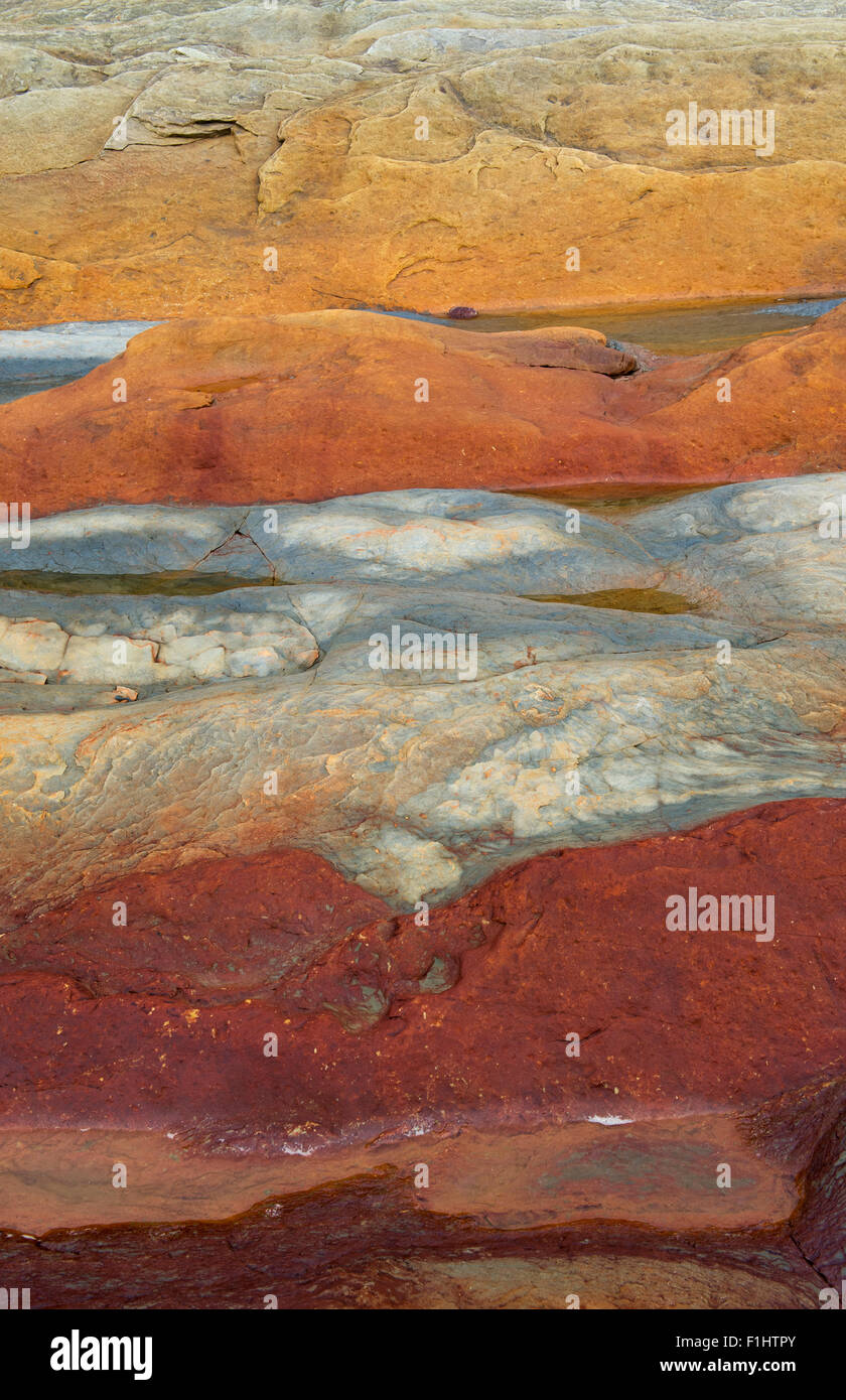 Spittal Beach Sandstone rock strata covered in iron ore. Spittal ...