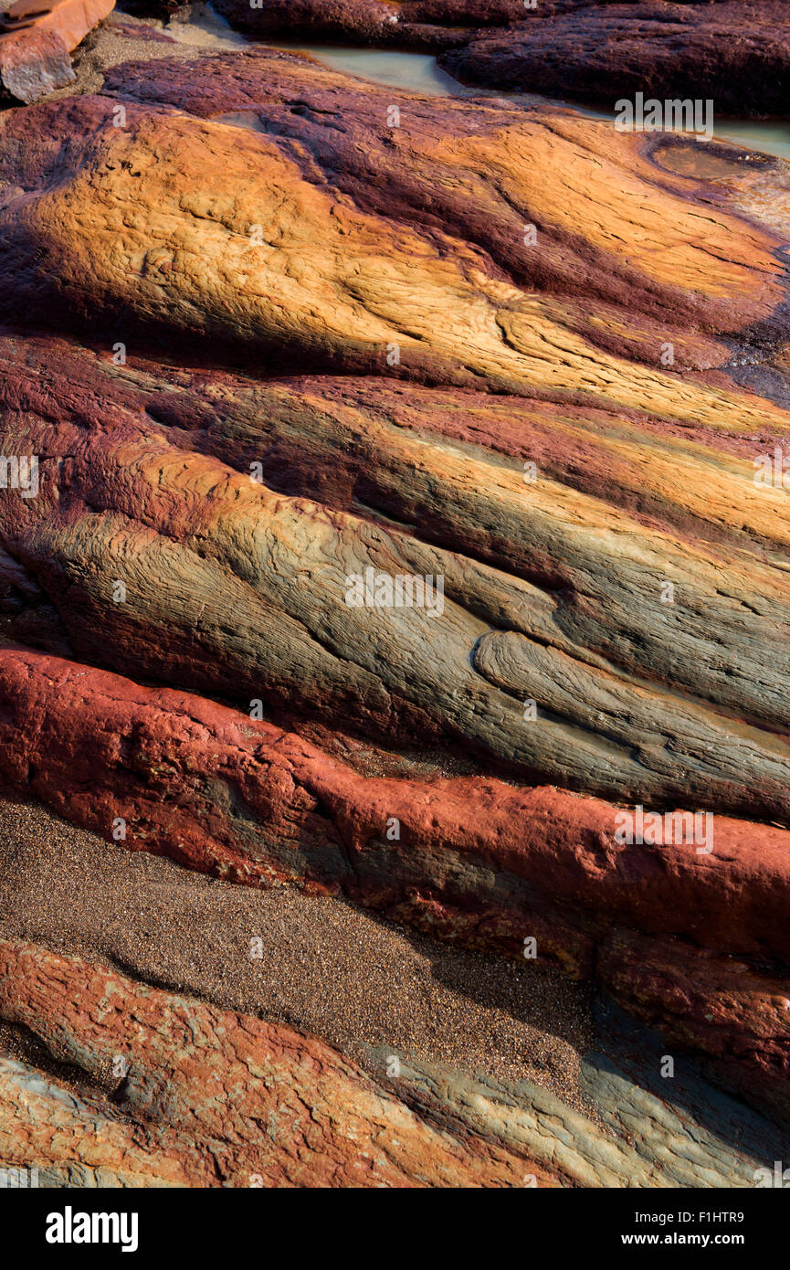 Spittal Beach Sandstone rock strata covered in iron ore. Spittal ...