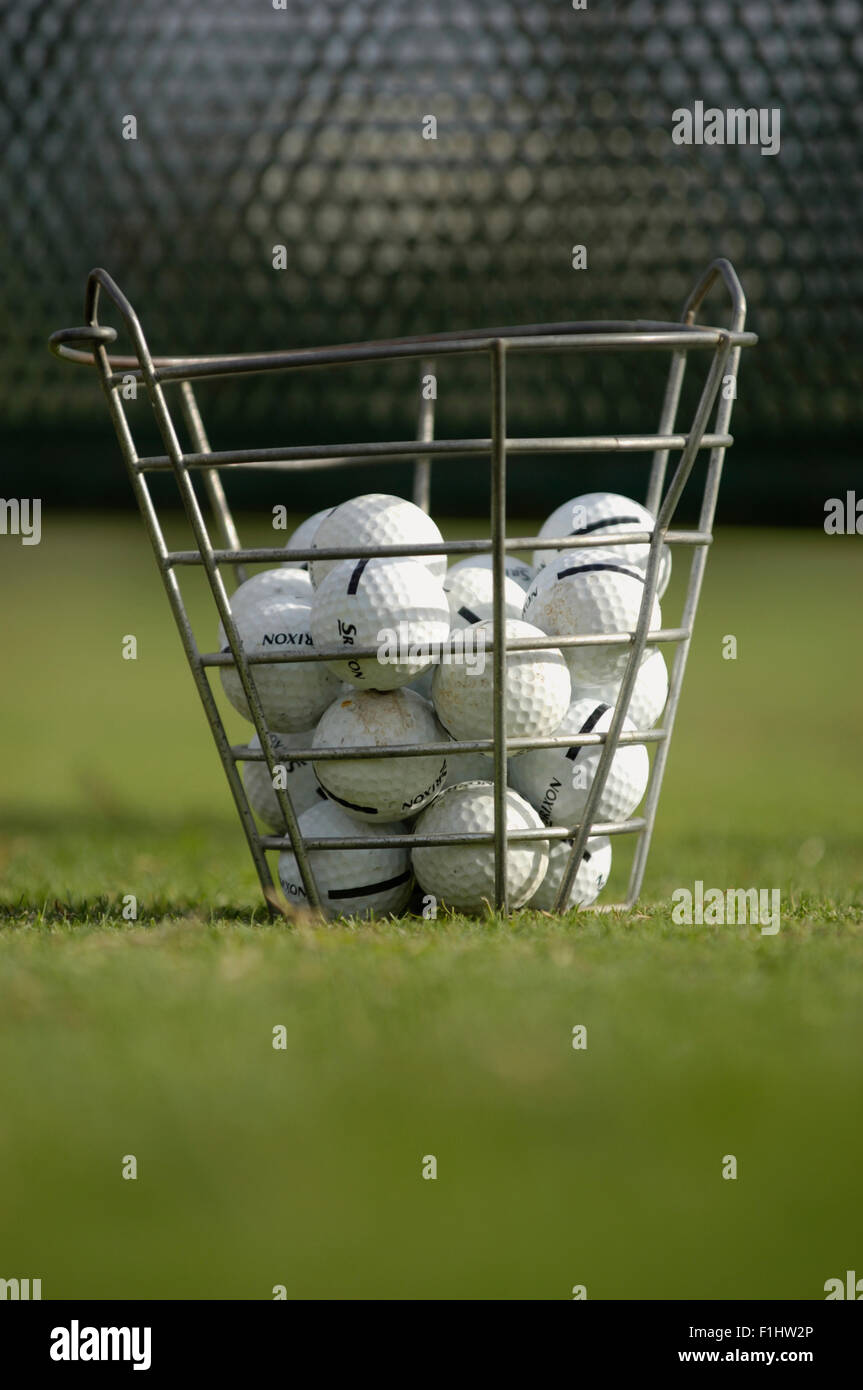 Golf balls in basket Stock Photo - Alamy