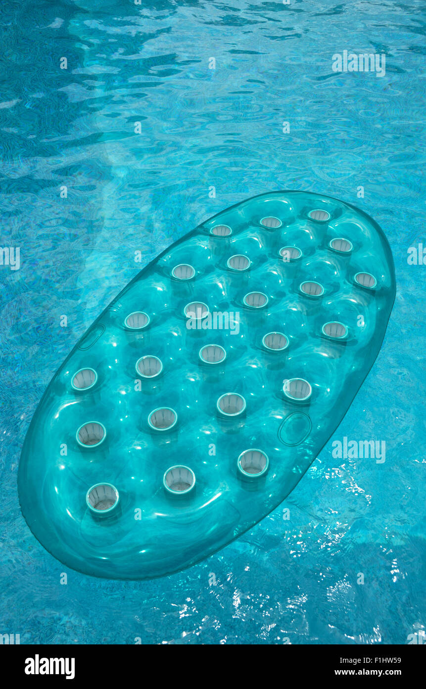 Empty raft floating in pool Stock Photo - Alamy