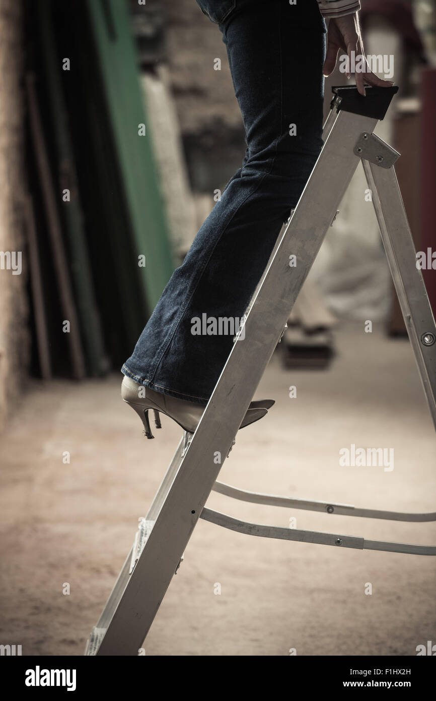woman in high heels on step ladder Stock Photo - Alamy