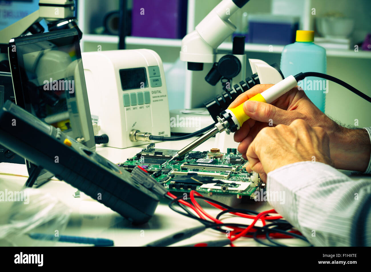 The soldering of chips on the printed circuit board Stock Photo - Alamy