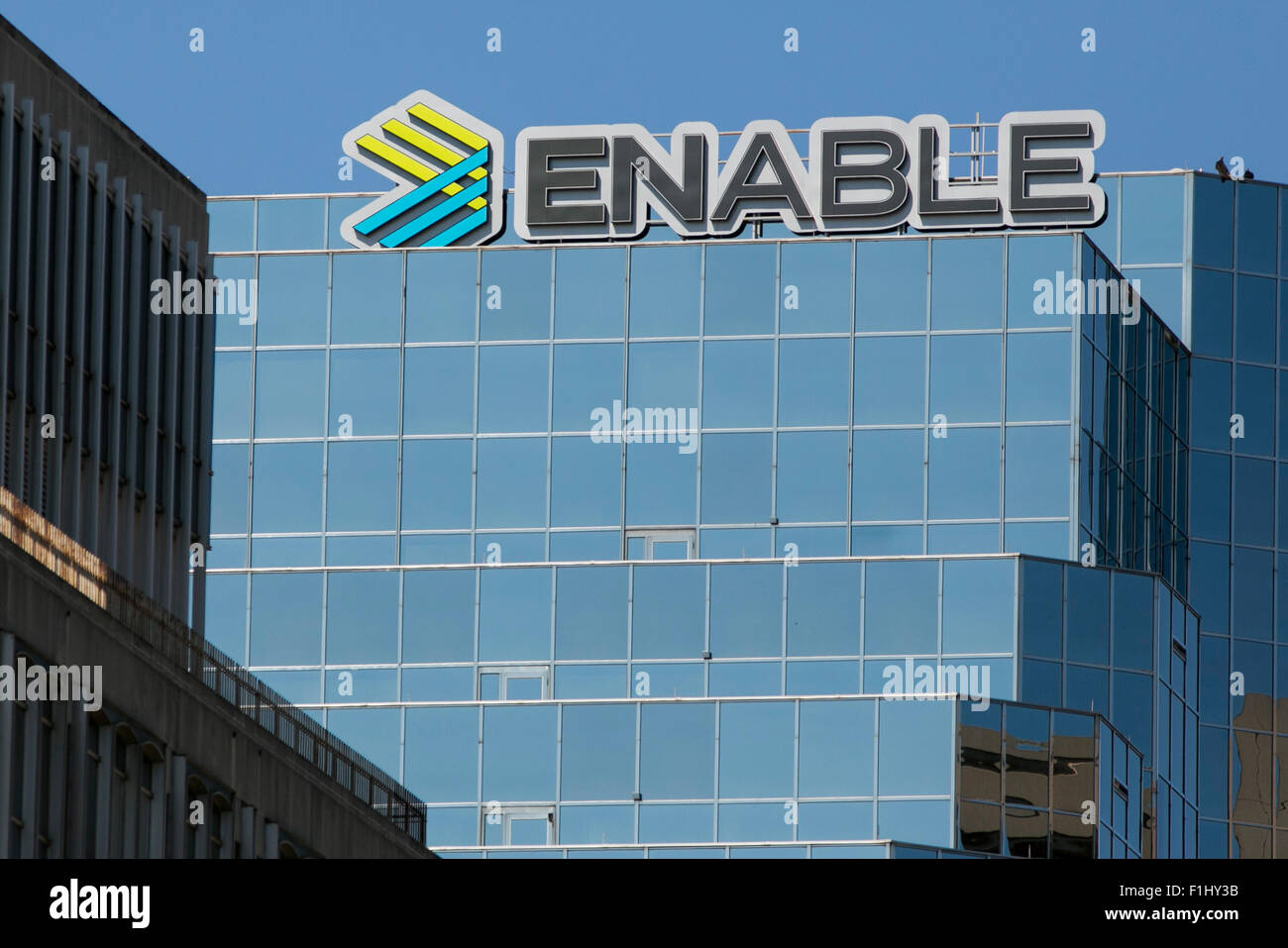 A logo sign outside of the headquarters of Enable Midstream Partners ...