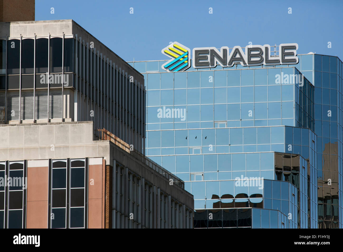 A logo sign outside of the headquarters of Enable Midstream Partners ...