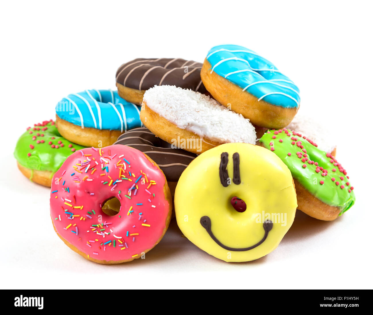 assorted glazed doughnuts in different colors on white background Stock ...