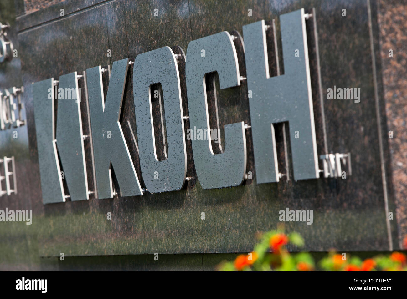 A logo sign outside of the headquarters of Koch Industries, Inc., in ...