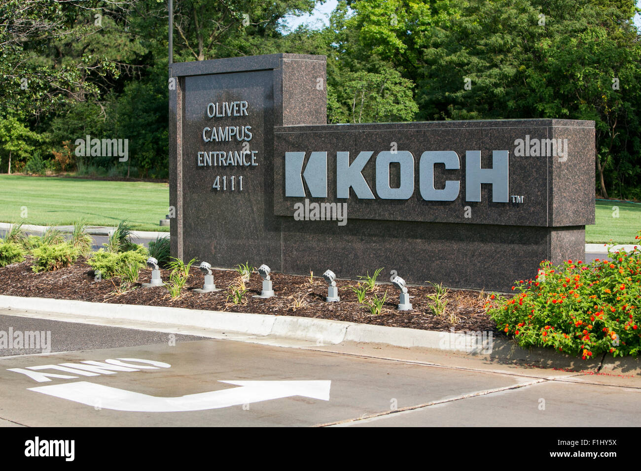 A logo sign outside of the headquarters of Koch Industries, Inc., in ...