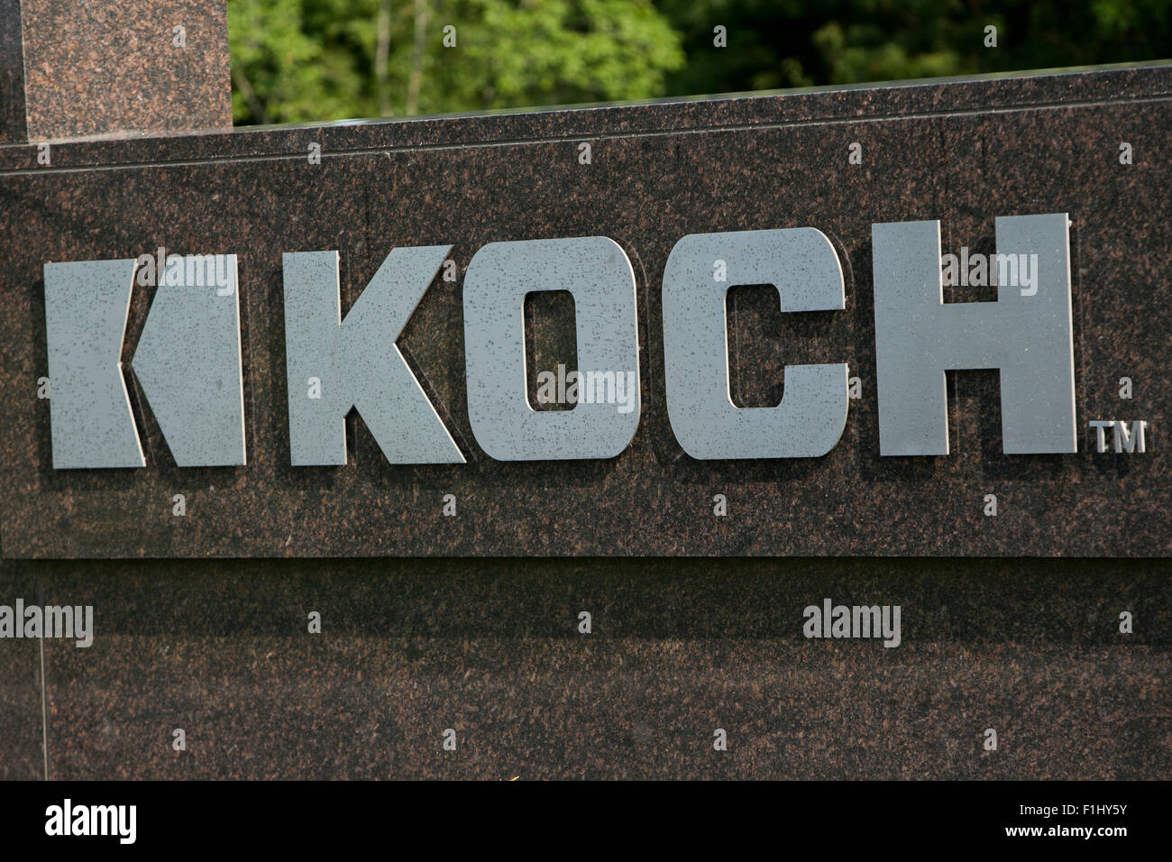 A logo sign outside of the headquarters of Koch Industries, Inc., in ...