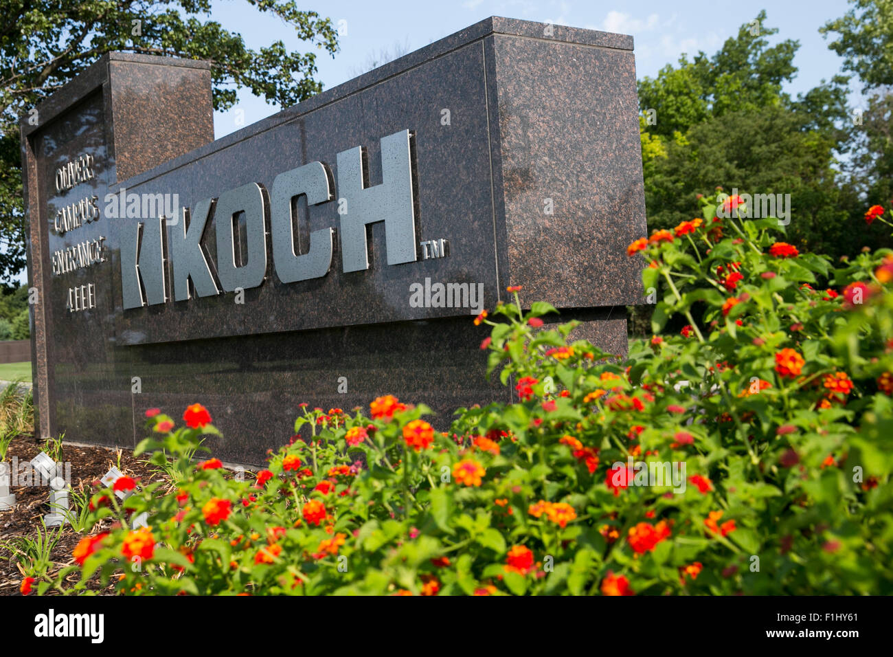A logo sign outside of the headquarters of Koch Industries, Inc., in ...