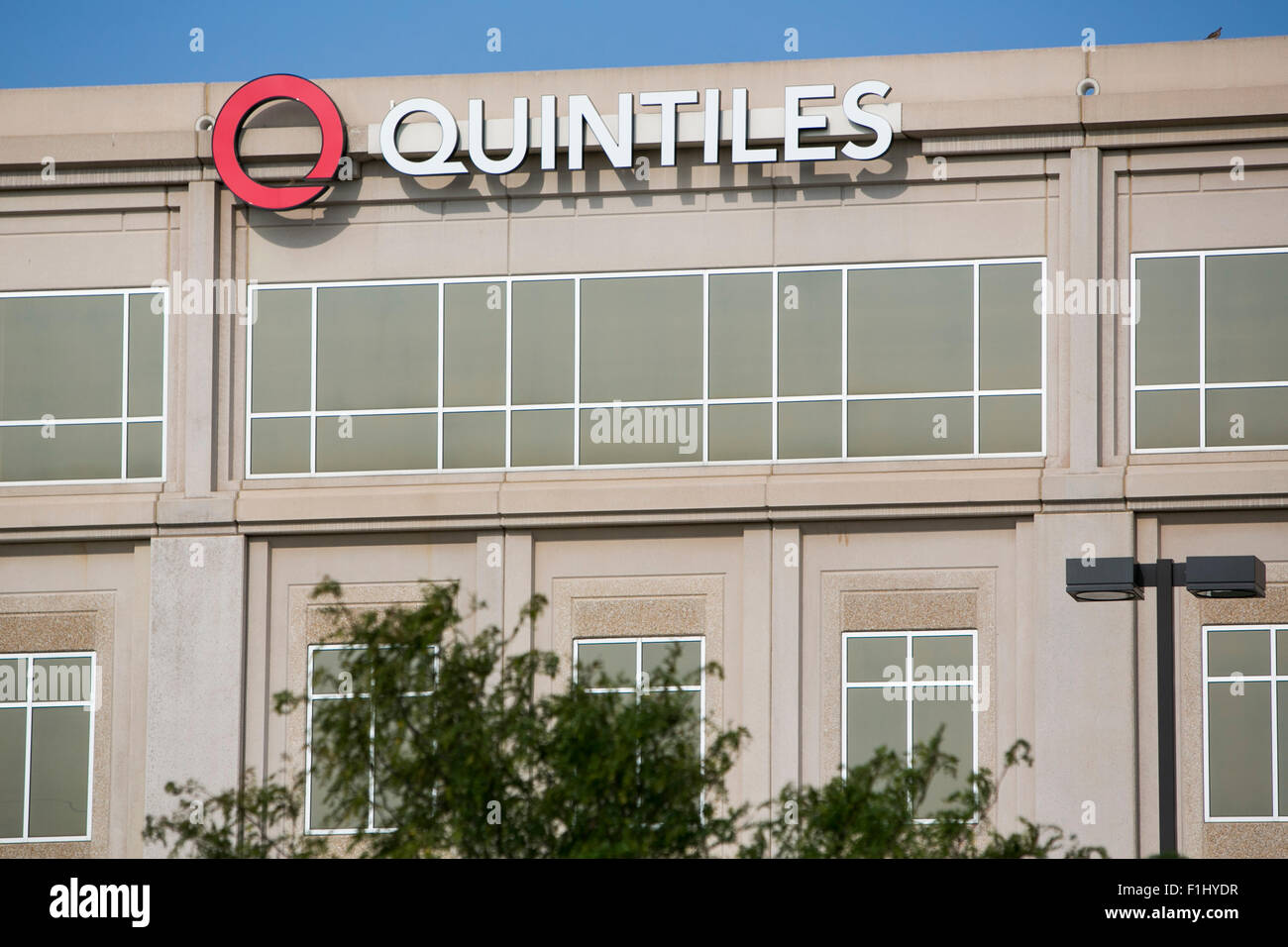 A logo sign outside of a facility occupied by Quintiles Transnational ...