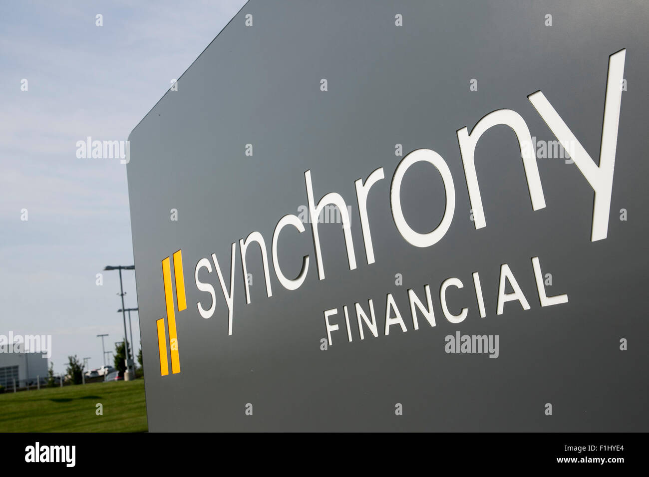 A logo sign outside of a facility occupied by Synchrony Financial in ...