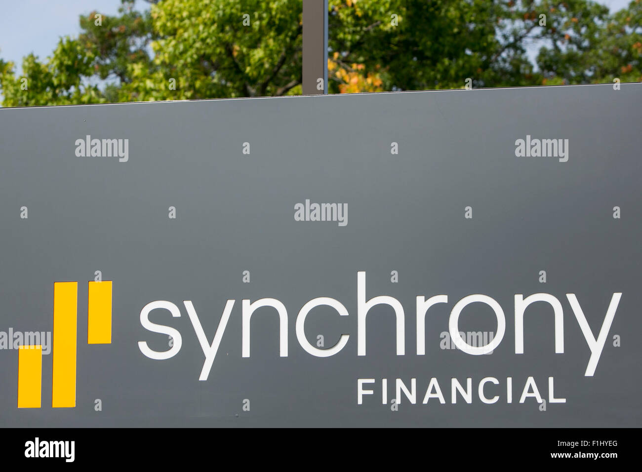 A logo sign outside of a facility occupied by Synchrony Financial in ...