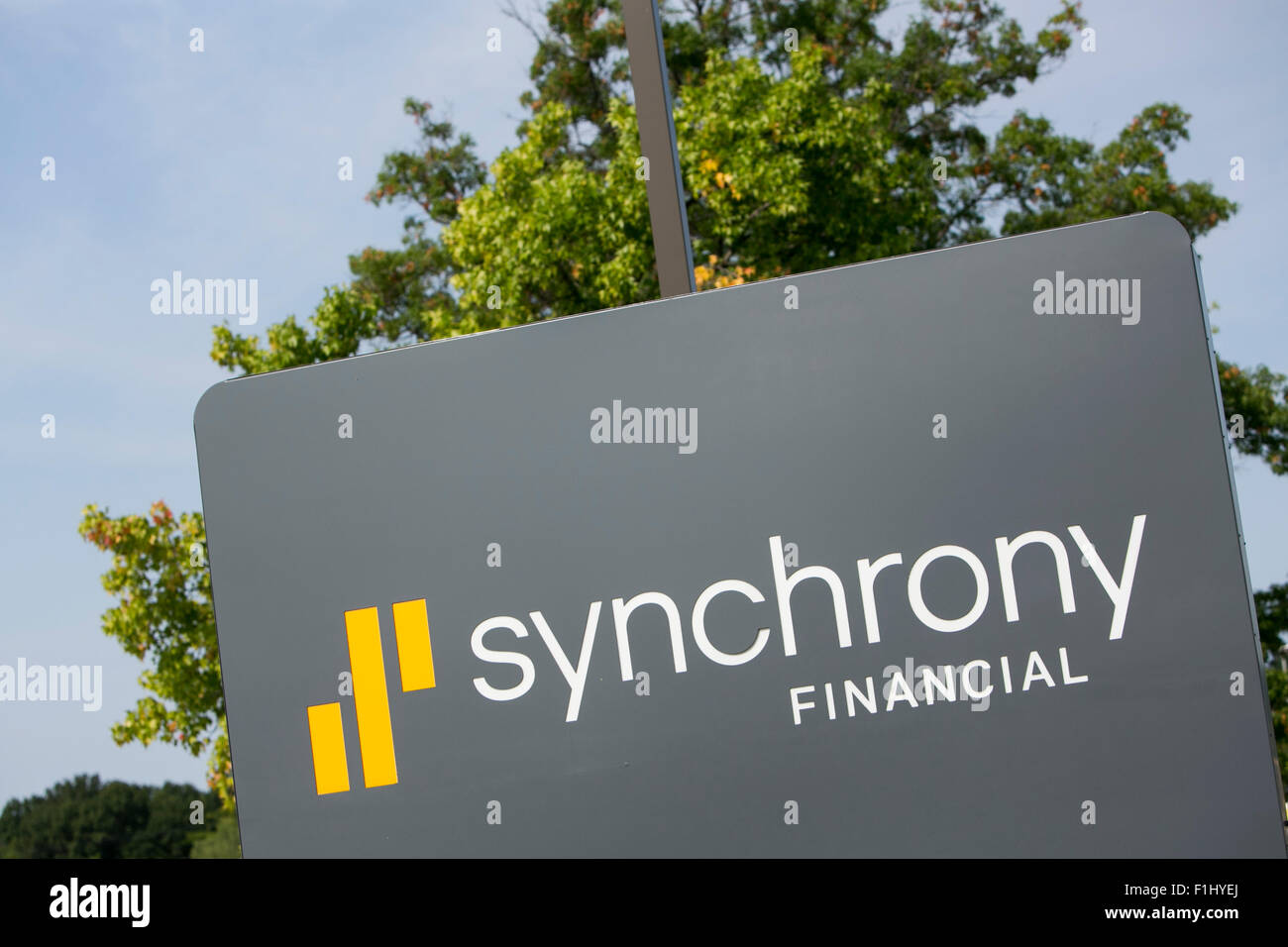 A logo sign outside of a facility occupied by Synchrony Financial in ...