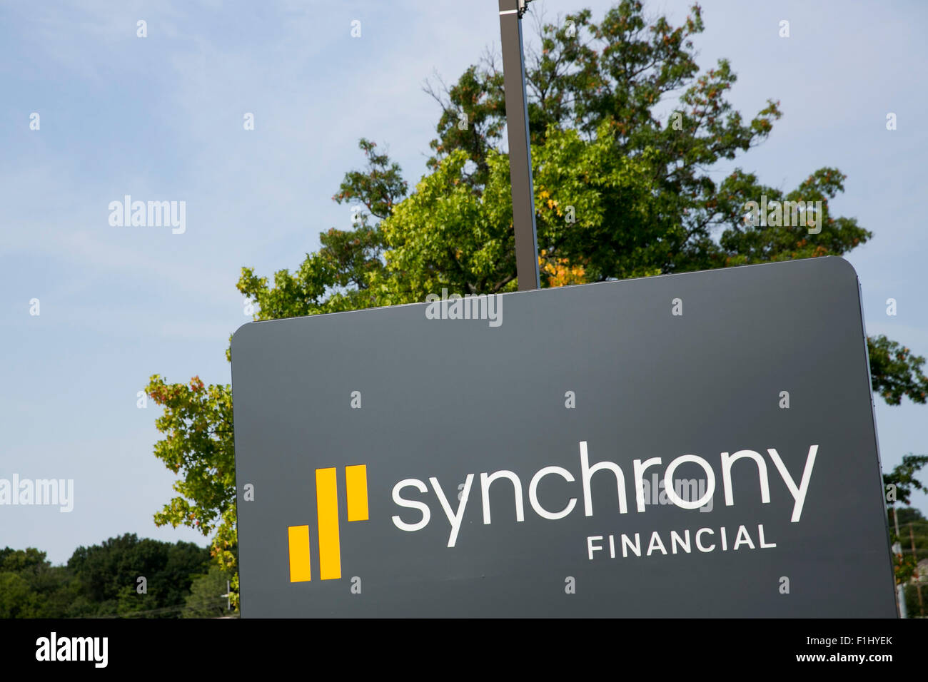 A logo sign outside of a facility occupied by Synchrony Financial in ...