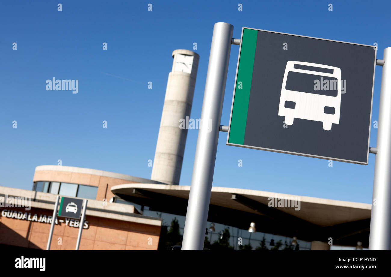 Bus signpost on a railway station with blue sky Stock Photo - Alamy