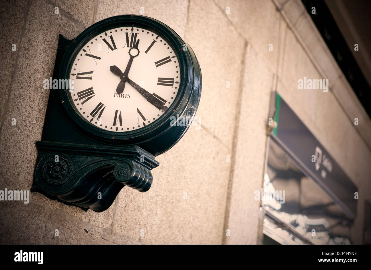 Railway station outdoor analog clock with roman numbers Stock Photo - Alamy
