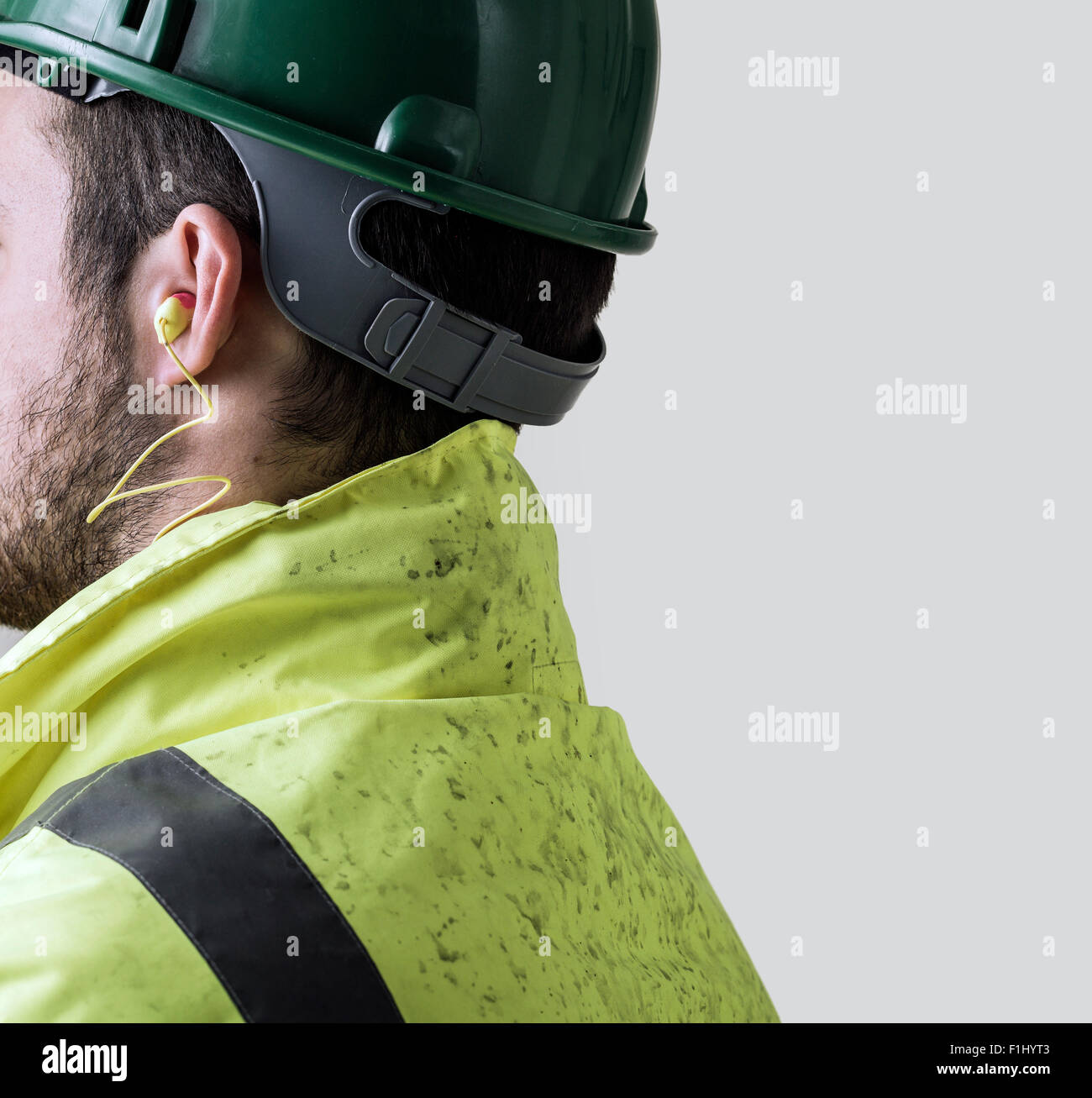 Construction worker with ear defenders Stock Photo - Alamy