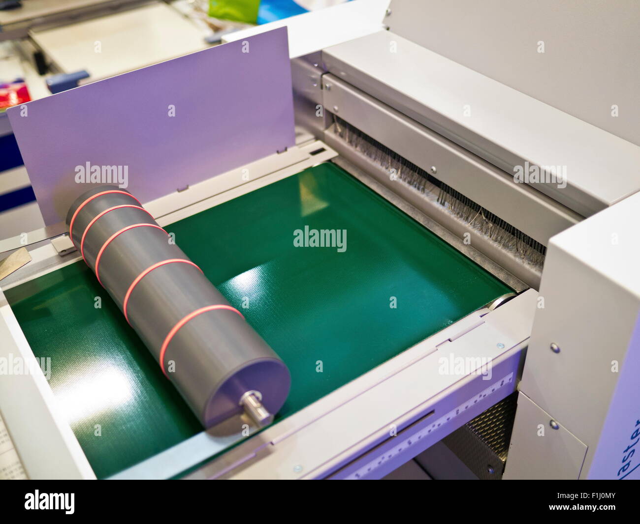 Closeup of printng machine working part with white light Stock Photo ...
