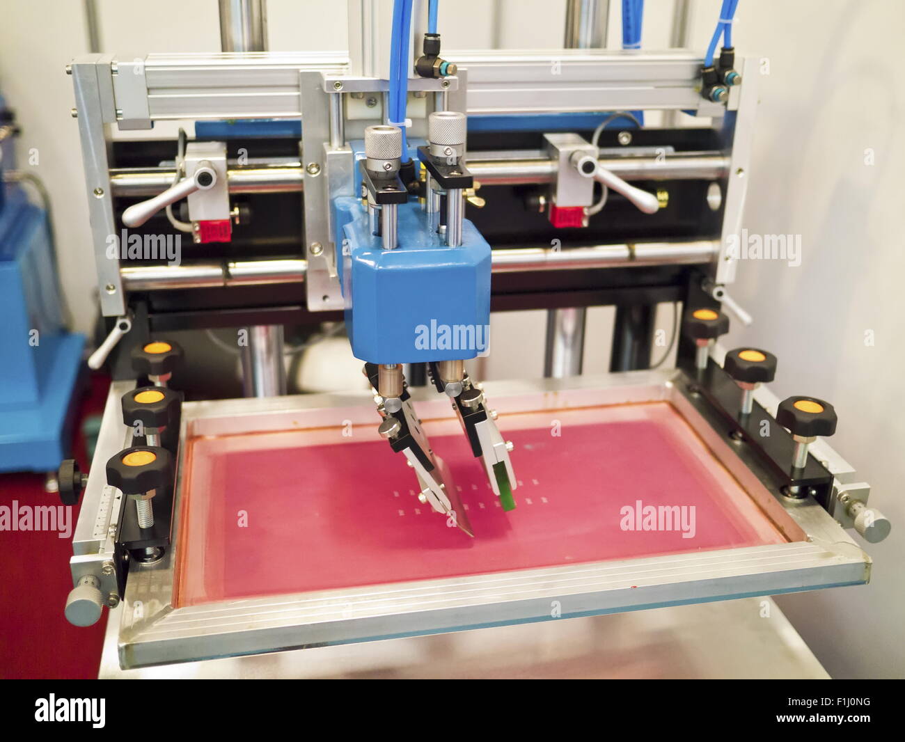 Closeup of printng machine working part with white light Stock Photo ...