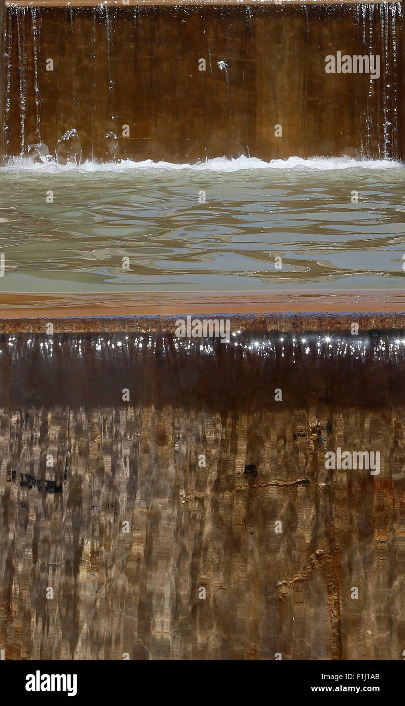 Water falling and flowing on a fountain background Stock Photo - Alamy