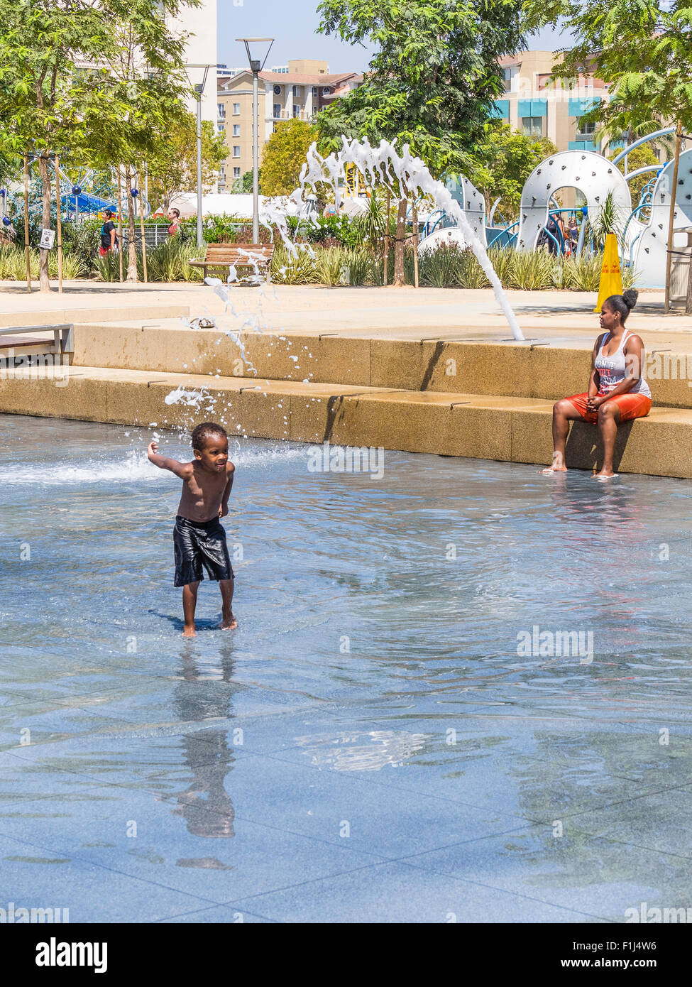 Children playing in water fountains at Waterfront Park, San Diego ...