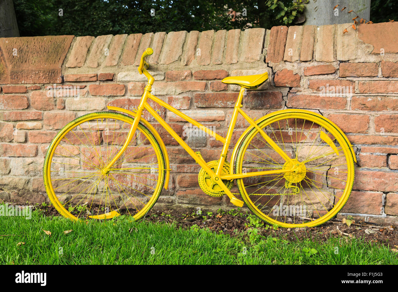 Yellow Bicycle. A yellow bicycle lining the route of the 2015 Tour of ...