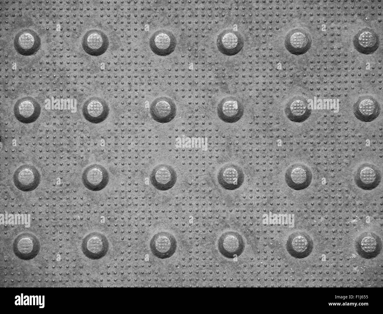 Dot patterns on a rusty iron plate make an interesting design. Black ...