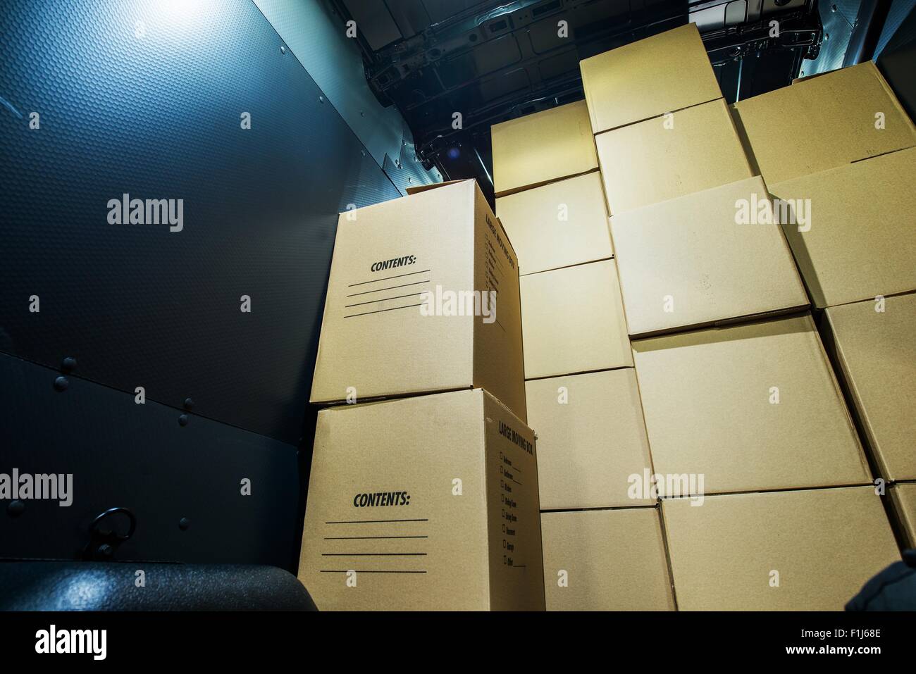 Pile of Boxes in a Cargo Van Closeup. Products Transportation Industry ...