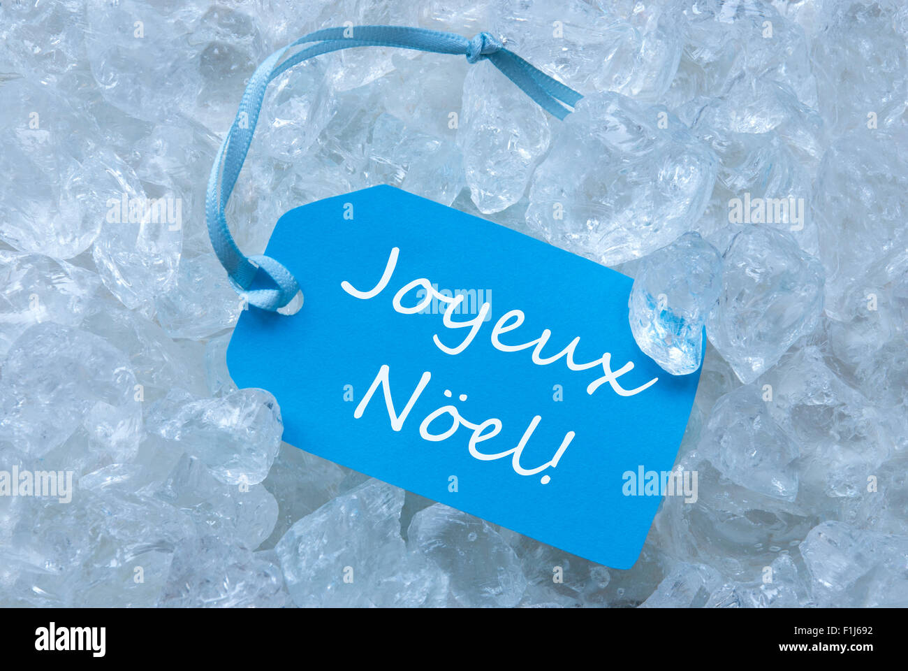 Label On Ice With Joyeux Noel Mean Merry Christmas Stock Photo - Alamy