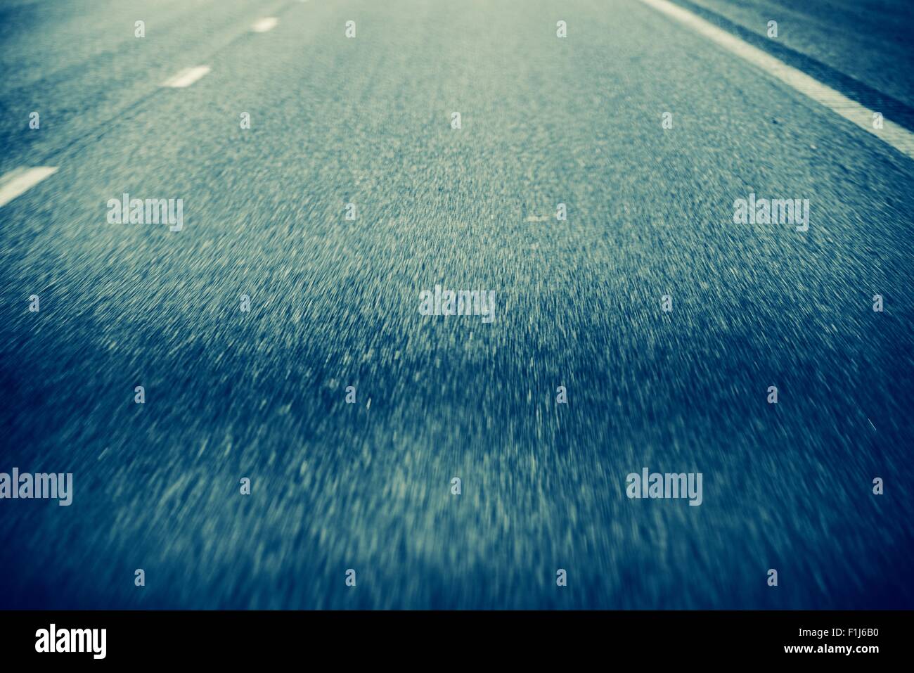On the Road Background. Road in Motion. Pavement Closeup During Driving ...