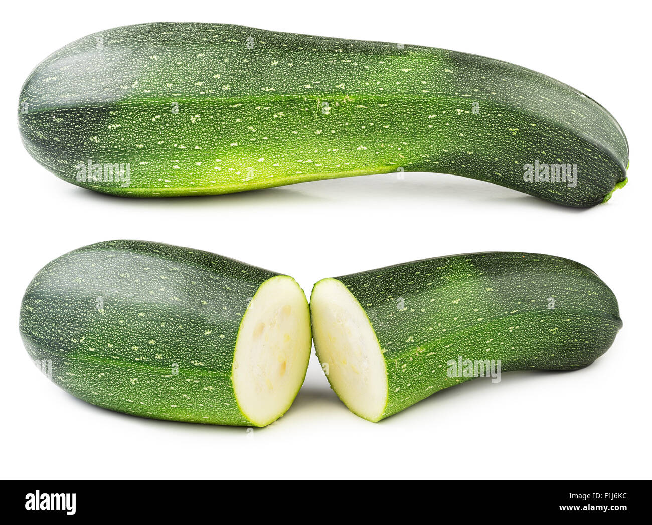 Fresh courgette cut in half isolated on white background Stock Photo ...