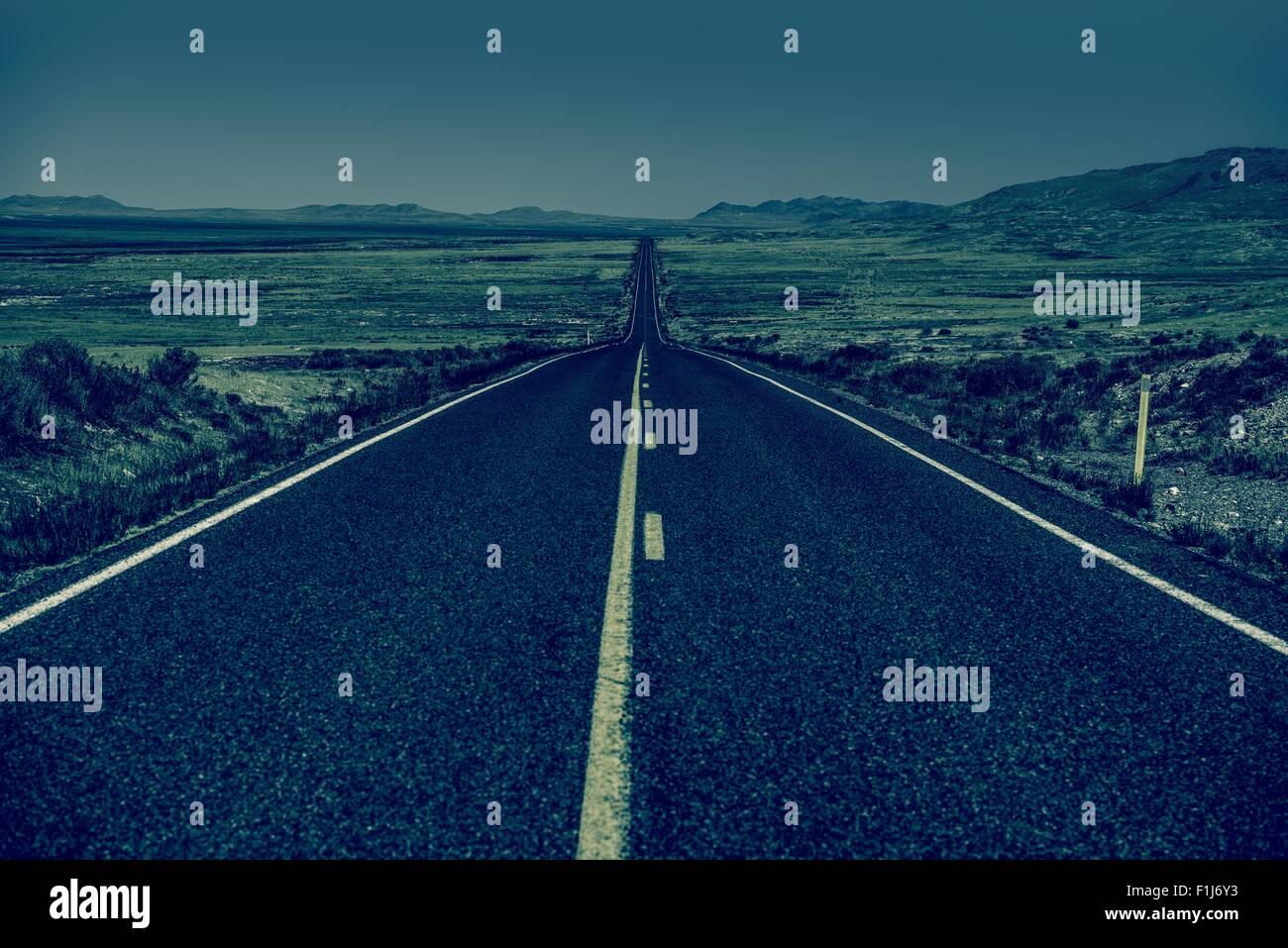 Down the Road. Straight Desert Highway in Bluish Color Grading ...